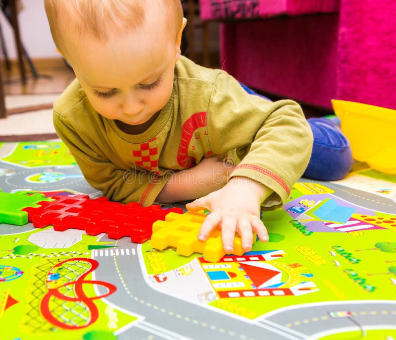 Boy Playing with Plastic Blocks in Home Stock Photo - Image of ...