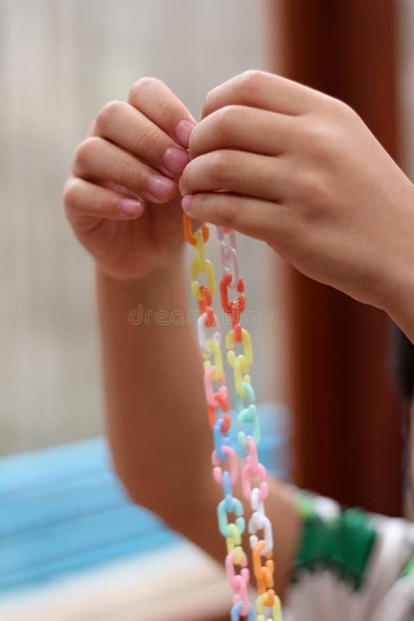A Boy is Playing Plastic Chain Toy Stock Photo - Image of happy ...