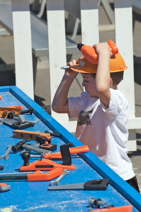 Boy Playing with Plastic Tools Stock Image - Image of child, site: 13263375