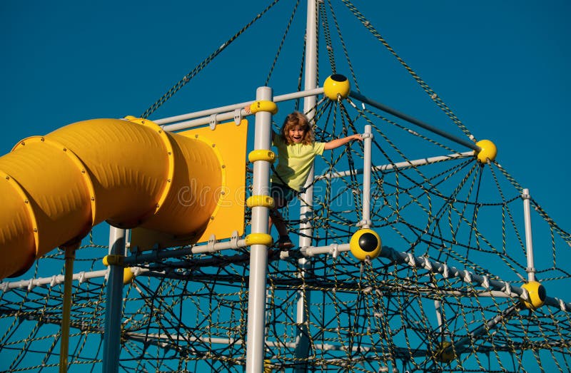 Boy Playing in the Playground. Kids Play Outdoor. Stock Photo - Image ...