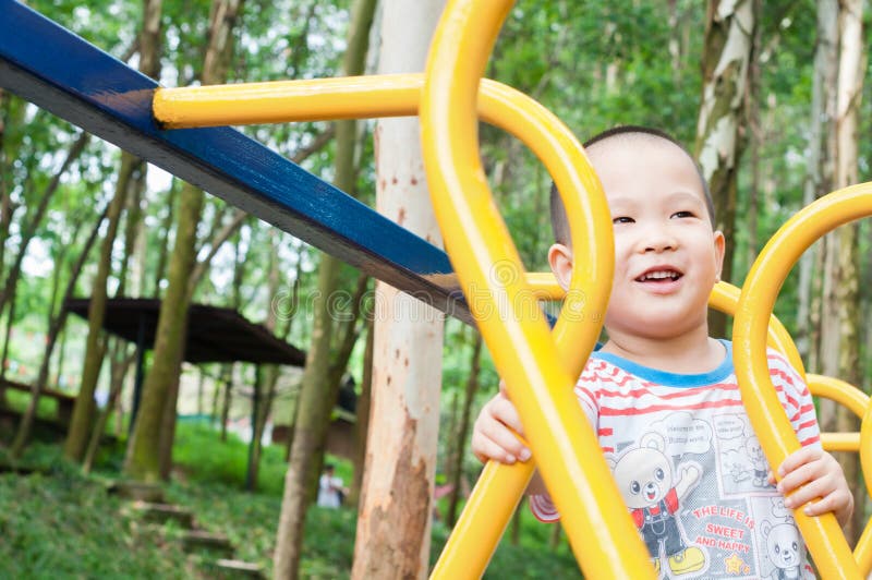 Boy playing on playground stock photo. Image of asia - 47590174