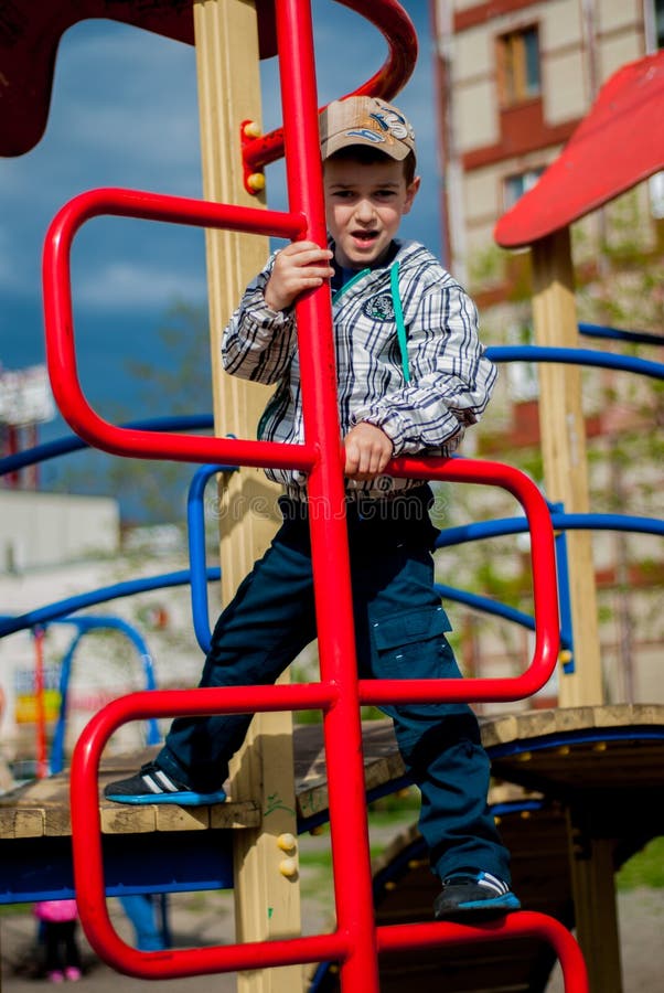 Boy Playing on the Playground Editorial Photography - Image of sity ...