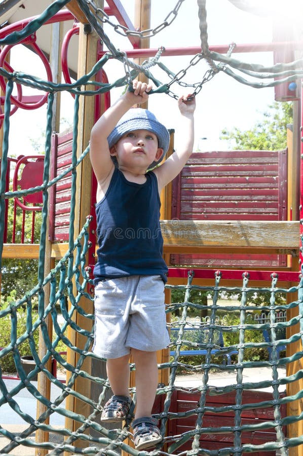 Boy Playing on the Playground Stock Photo - Image of family, small ...