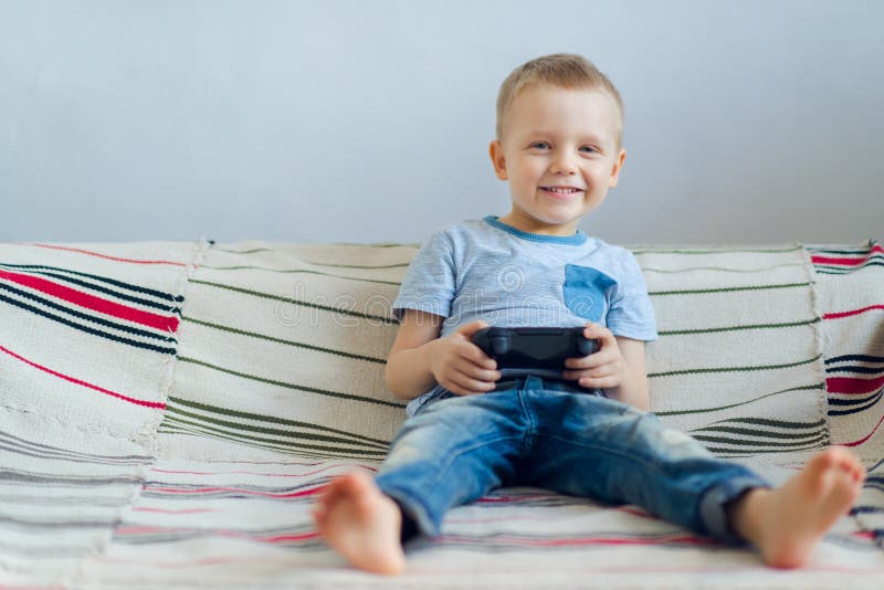 Young Boy Playing with Playstation Stock Photo - Image of playstation ...