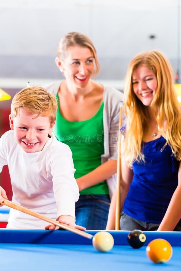 Boy Playing Pool Billiard with Family Stock Image - Image of three ...