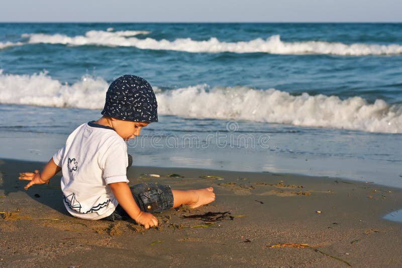 Boy playing with sand stock image. Image of childhood - 18836771