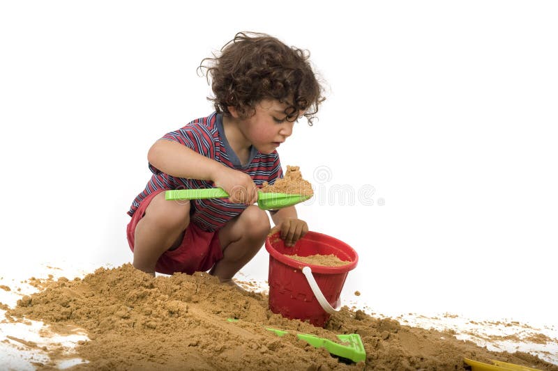 Boy playing in the sand stock photo. Image of healthy - 5323482