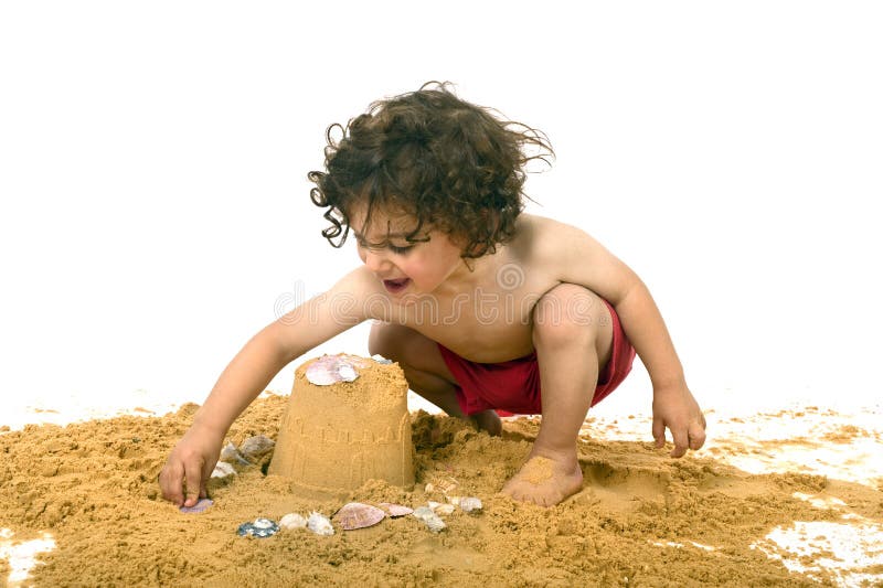 Boy playing in the sand stock photo. Image of healthy - 5323482