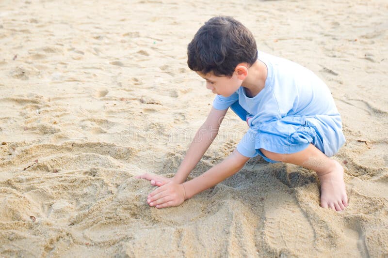 Boy Playing with Sand at the Beach Stock Image - Image of childhood ...