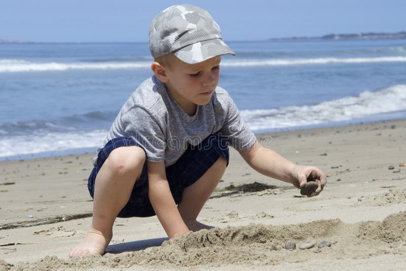Boy Playing in the Sand Near the Pacific Ocean Stock Image - Image of ...