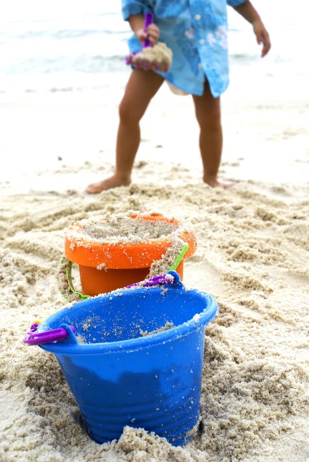 Boy playing with sand toys stock image. Image of children - 1851421