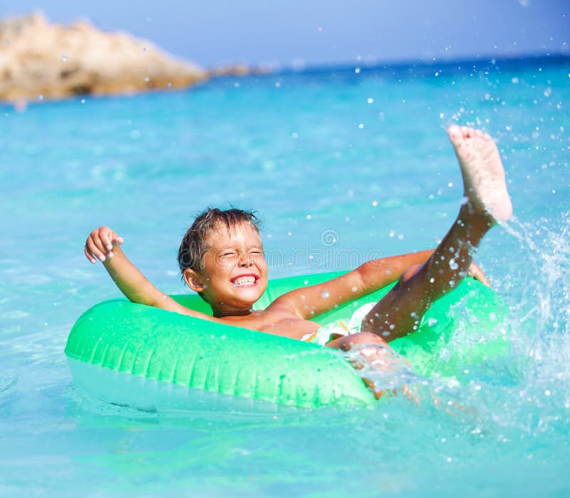 Boy playing in the sea stock image. Image of leisure - 51944779