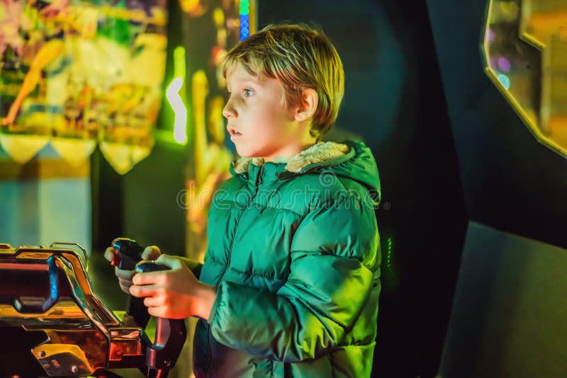1,084 Boy Playing Game Machine Stock Photos - Free & Royalty-Free Stock ...
