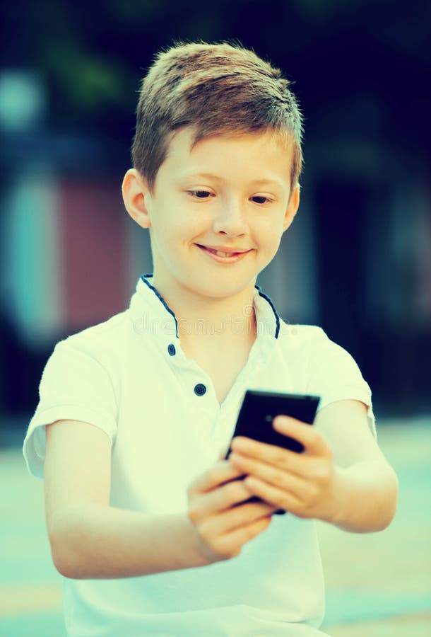 Boy Playing with Smartphone Stock Photo - Image of expression ...