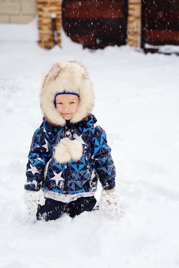 Boy playing in snow stock image. Image of face, frost - 238853701