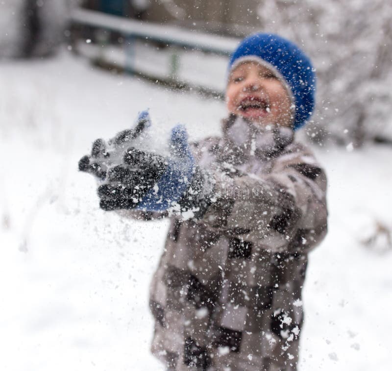 Boy Playing with Snow in Winter Stock Photo - Image of cold, kids: 91741244