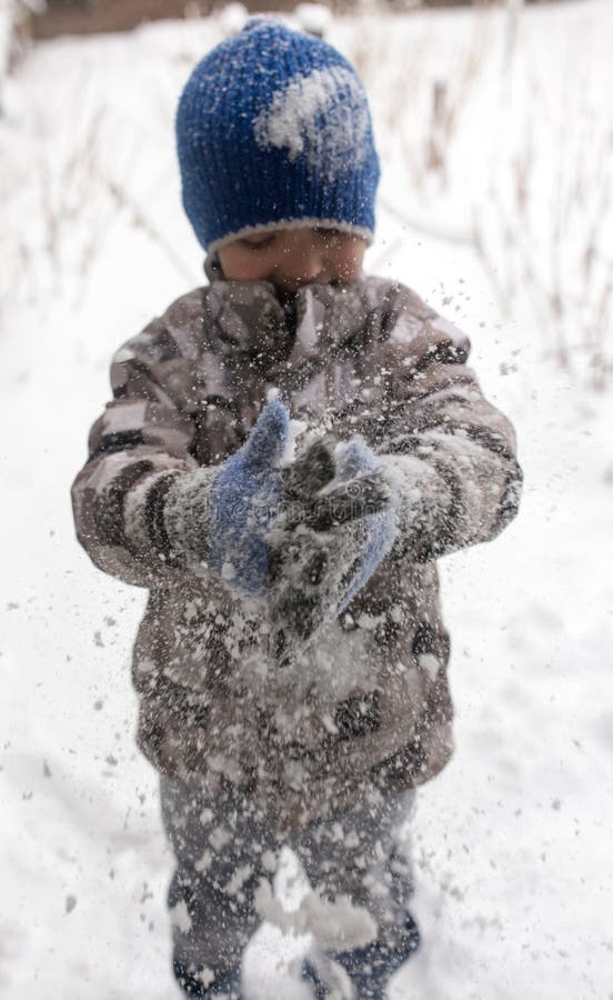 Boy Playing with Snow in Winter Stock Image - Image of playing, cold ...