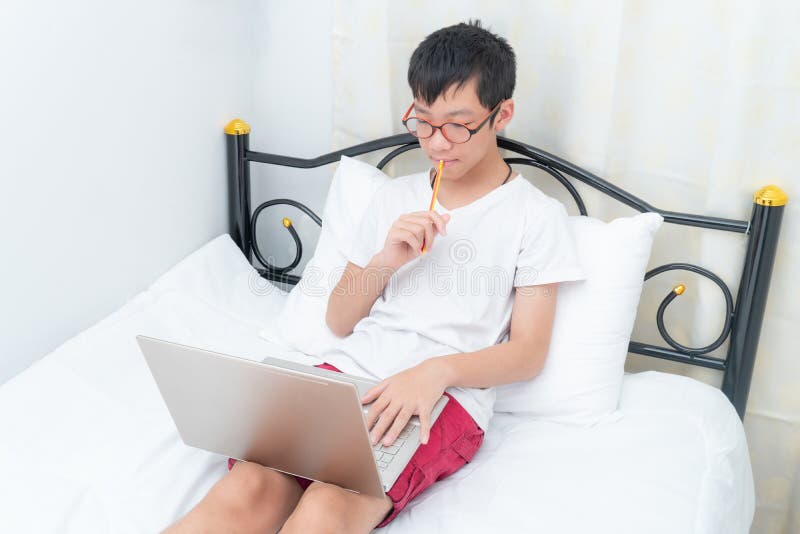 A Boy Playing Social Media with Laptop Stock Photo - Image of media ...