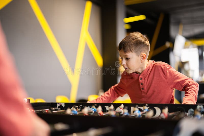 Boy Playing Table Football in Kids Play Center Stock Image - Image of ...