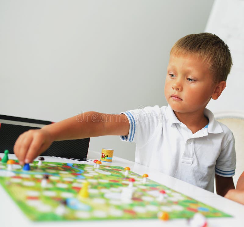 A Boy Playing with Table Game Stock Image - Image of concentrated ...