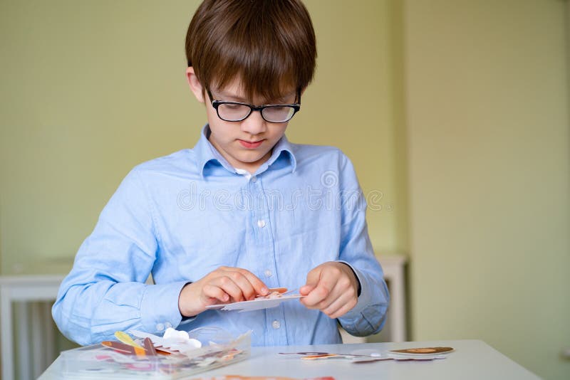 Boy Playing Learning Game Design and Assemble Face Stock Image - Image ...