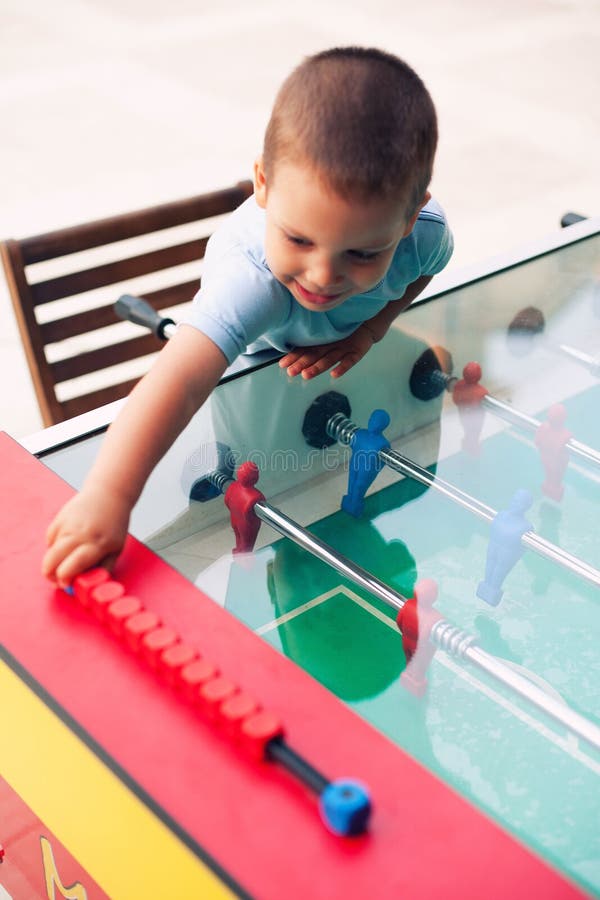 Boy playing table soccer stock photo. Image of goal, sport - 23080556
