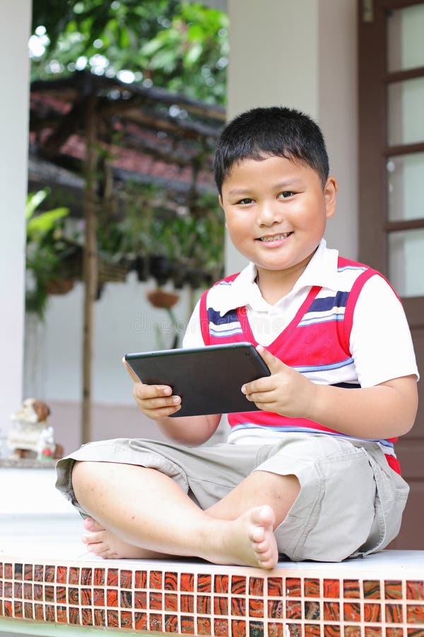 Boy playing Tablet fun. stock photo. Image of happy, internet - 32478580