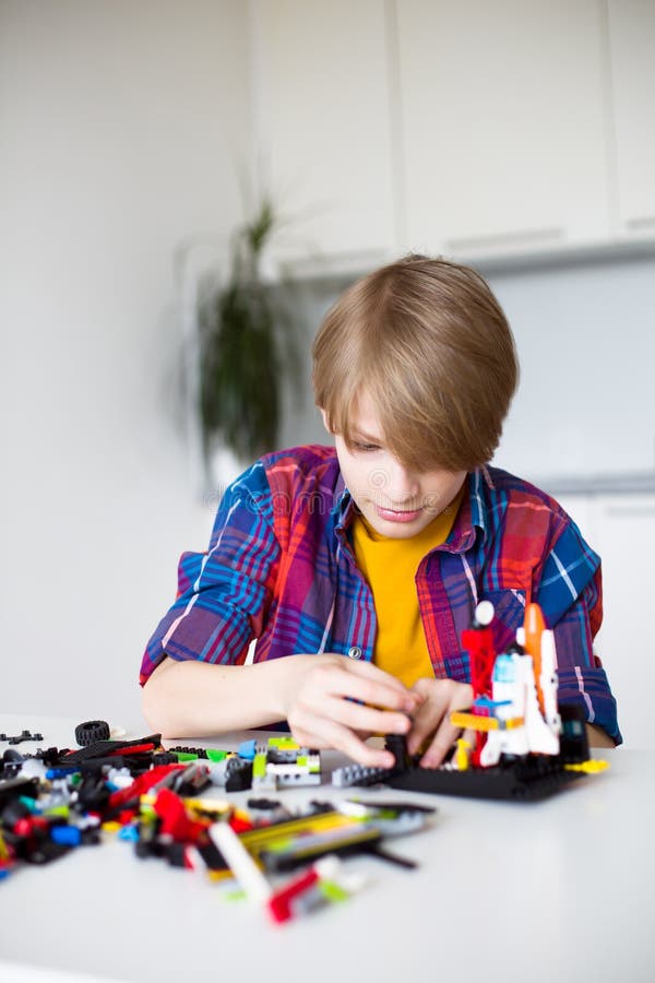 Boy Playing with Toy Construction Set, Focused and Curious Stock Photo ...