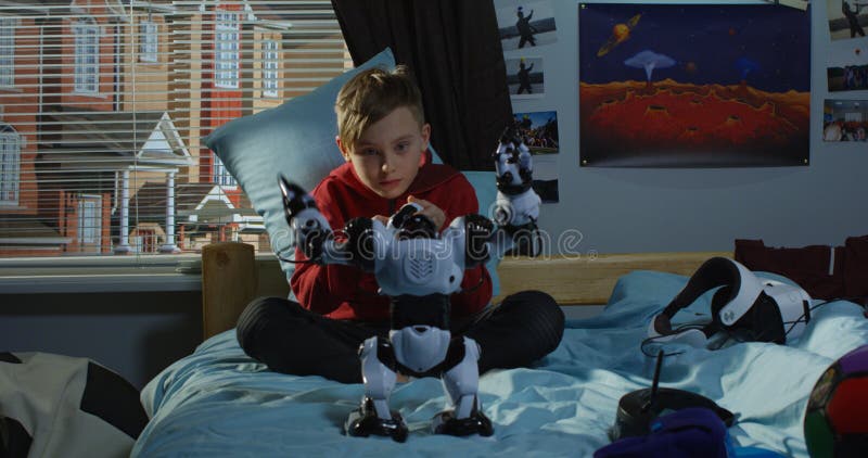 Boy Playing with a Toy Robot Stock Image - Image of male, controlling ...