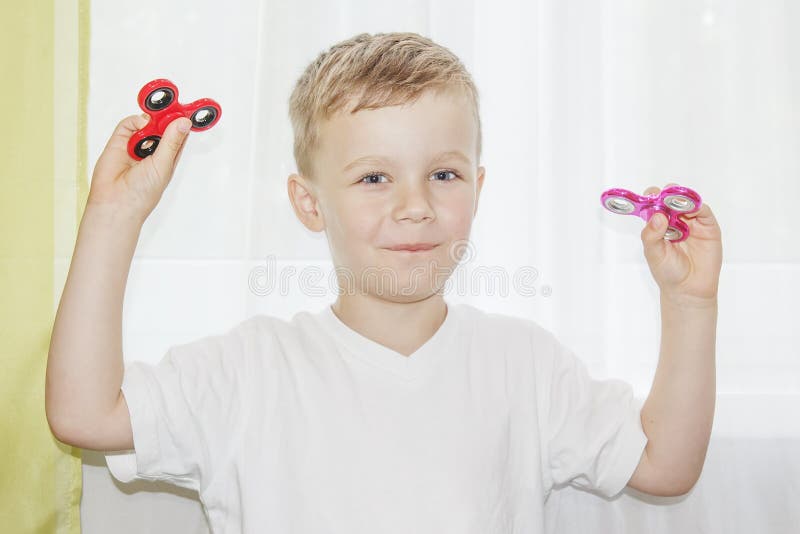 Boy Playing with Two Hand Spinner. Stock Image - Image of bearing ...