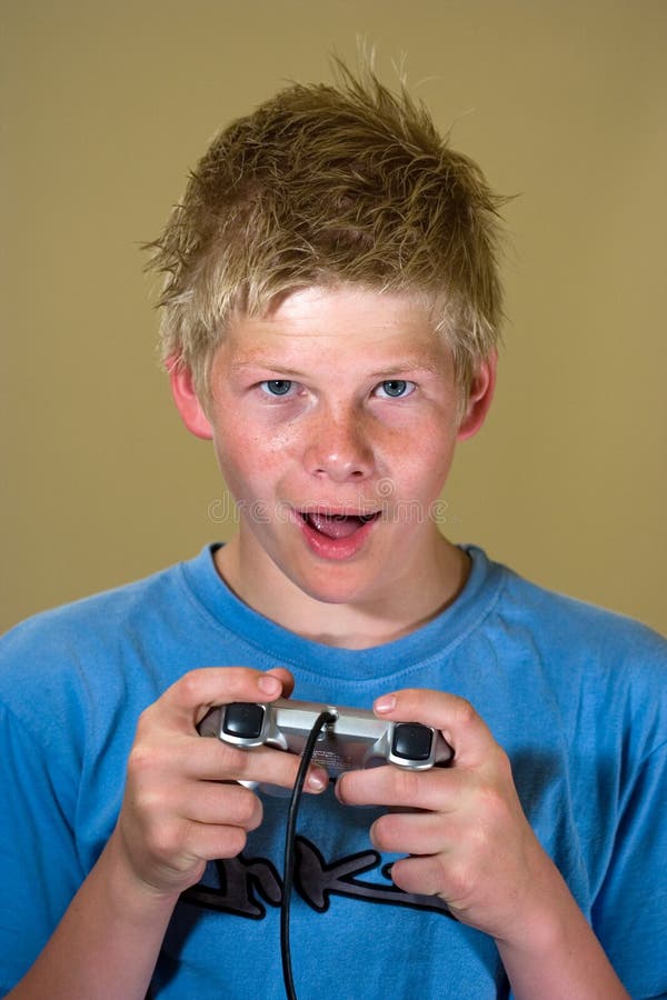 Boy playing a video game stock image. Image of video, person - 5437545