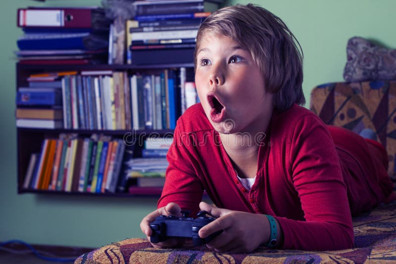 Boy Playing a Video Game Console. Stock Image - Image of behavior, male ...