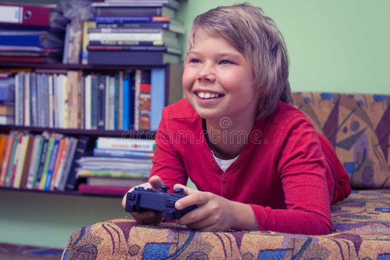 Boy playing on the PSP stock image. Image of happy, hobbies - 33005357