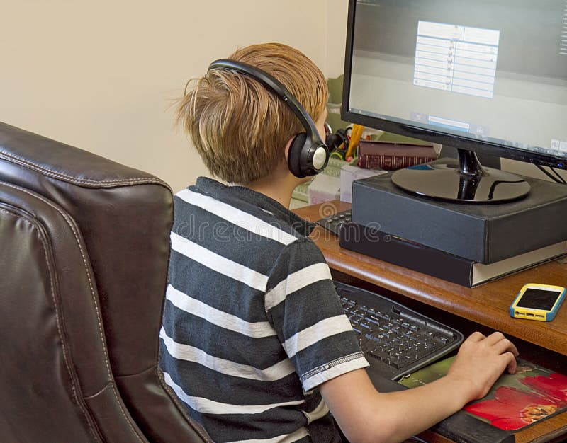 Boy playing computer games stock photo. Image of concentrate - 18087016