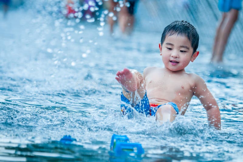 Boy splash water stock image. Image of head, splash, splashing - 65579607