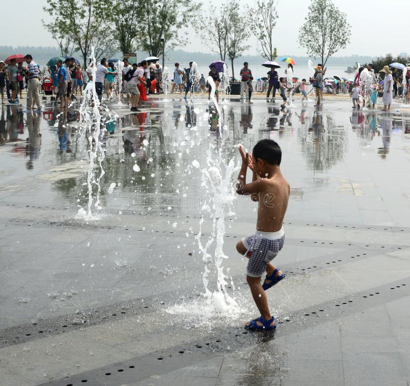 Playing with water editorial stock image. Image of casual - 12756764