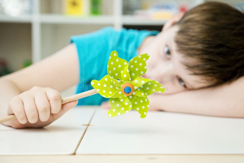 Boy Playing with Windmill at Home Stock Photo - Image of person, child ...