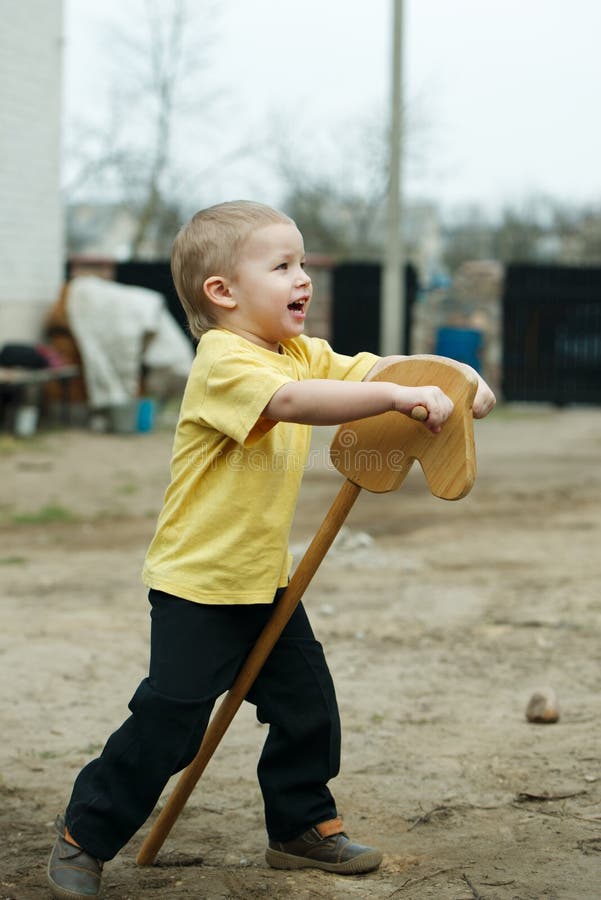 Little boy digging a hole stock image. Image of farmer - 58069575