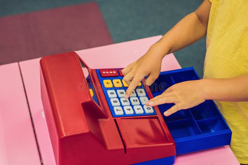 The Boy Plays with the Children`s Cash Register Stock Photo - Image of ...