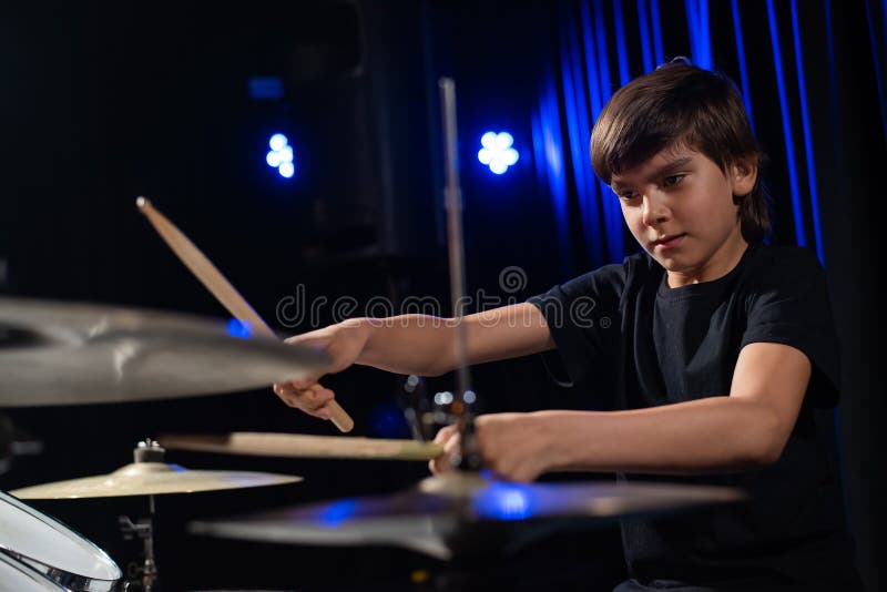A Boy Plays Drums in a Recording Studio Stock Photo - Image of drums ...