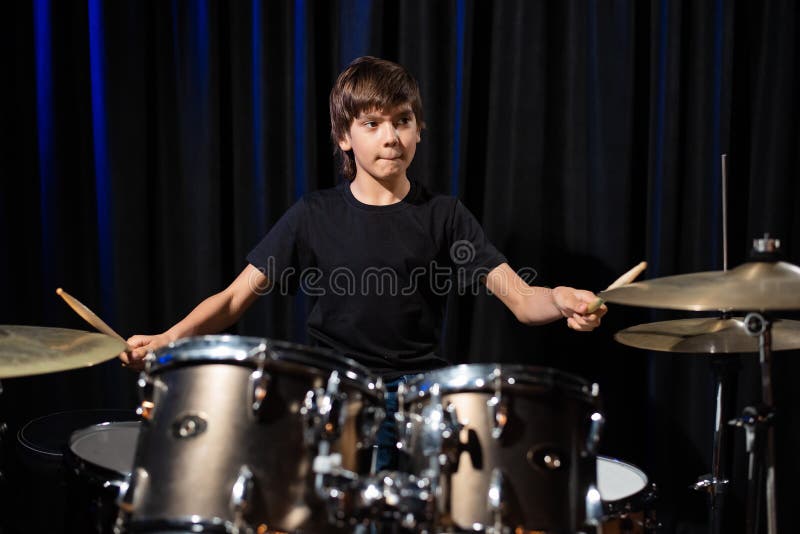 A Boy Plays Drums in a Recording Studio Stock Photo - Image of ...