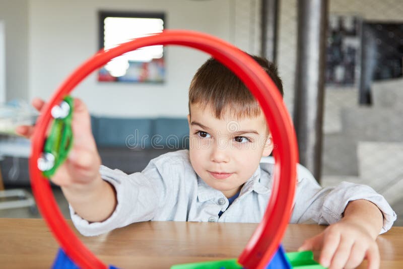 Boy Plays Full of Imagination with Car on the Loop Stock Photo - Image ...