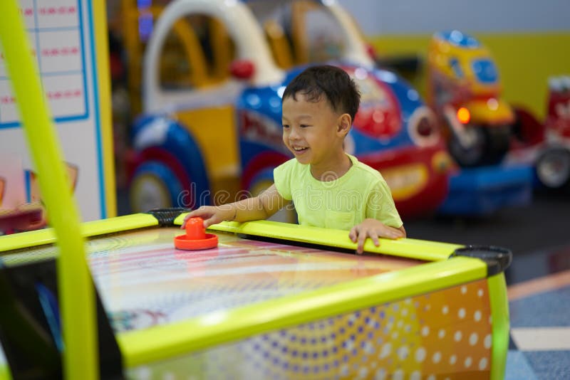 Boy Plays Game in Arcade in Mall Playground Concept Stock Photo - Image ...