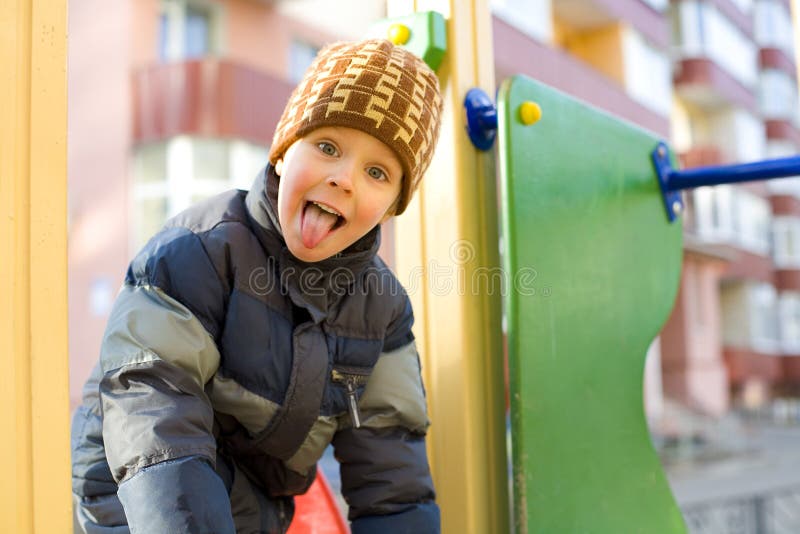 Boy plays at a playground stock photo. Image of plays - 40747514 Boy plays at a playground stock photo. Image of plays - 40747514
