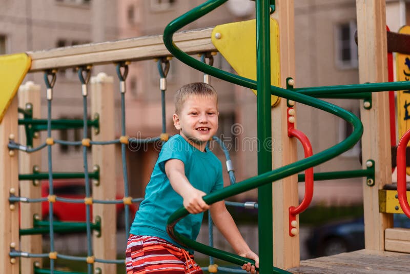 Boy Plays in the Playground Stock Image - Image of plays, lifestyle ...