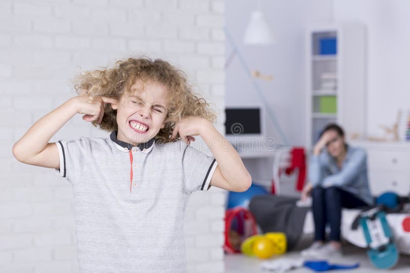 Boy with plugged ears stock image. Image of behaviour - 89392265