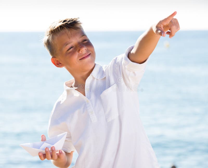 Boy pointing beach stock photo. Image of pointing, attentive - 82152572