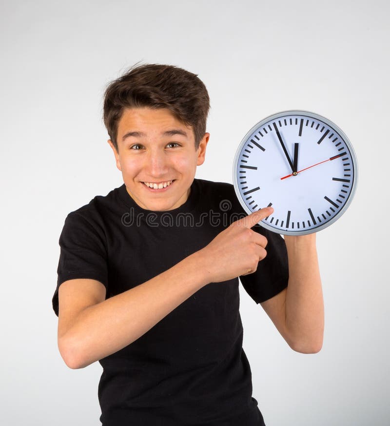 Boy pointing at clock stock image. Image of face, friendly - 37434713