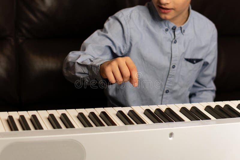 Boy Pointing Key Keyboard Playing Stock Photos - Free & Royalty-Free ...