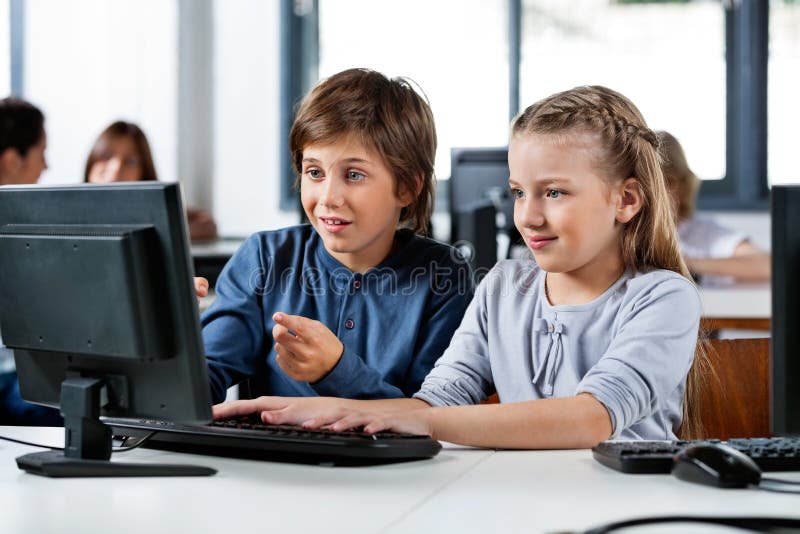 Boy and Girl Using Desktop Pc in School Computer Stock Image - Image of ...